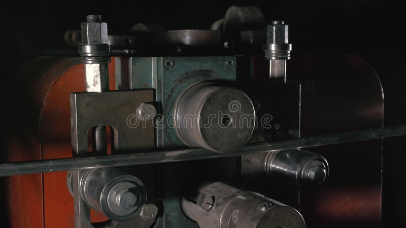 Forge Workshop on Table. Worker Bends the Metal Rod on the Wrought Iron ...