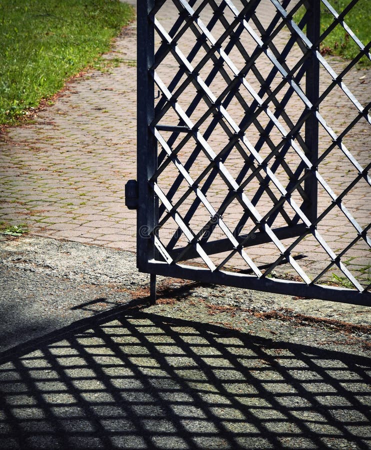 Forged Iron Gate Open with Shadow Stock Photo - Image of open ...