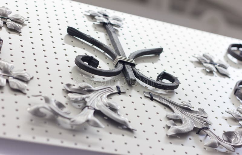 Forged Iron Products. Beautiful Wrought Iron Products on a Stand Stock ...