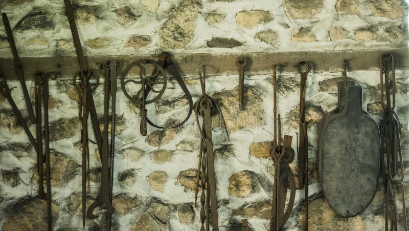 Forged Items, Tools of Ancient Times Hang on the Wall of the Barn Stock ...