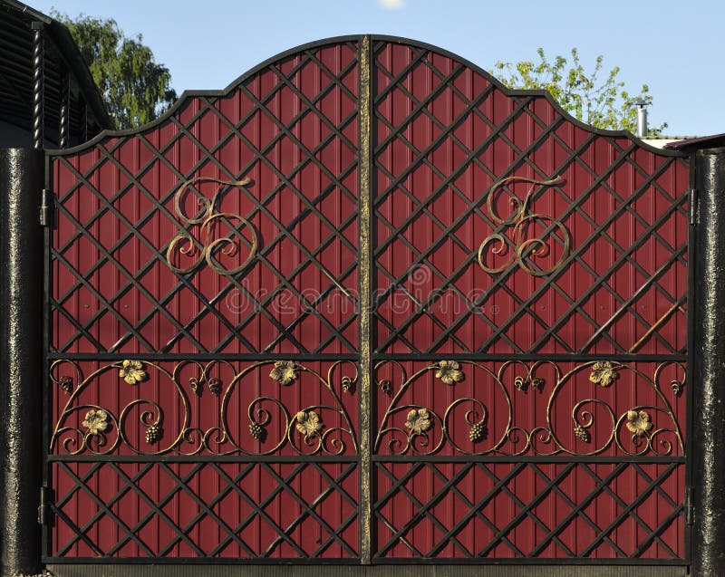 On the Forged Red Gate There are Gold Monograms and Patterns. Stock ...
