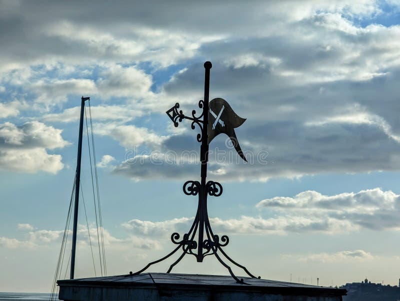 Forged Weather Vane with Cannons and a Beautiful Sky Stock Photo ...