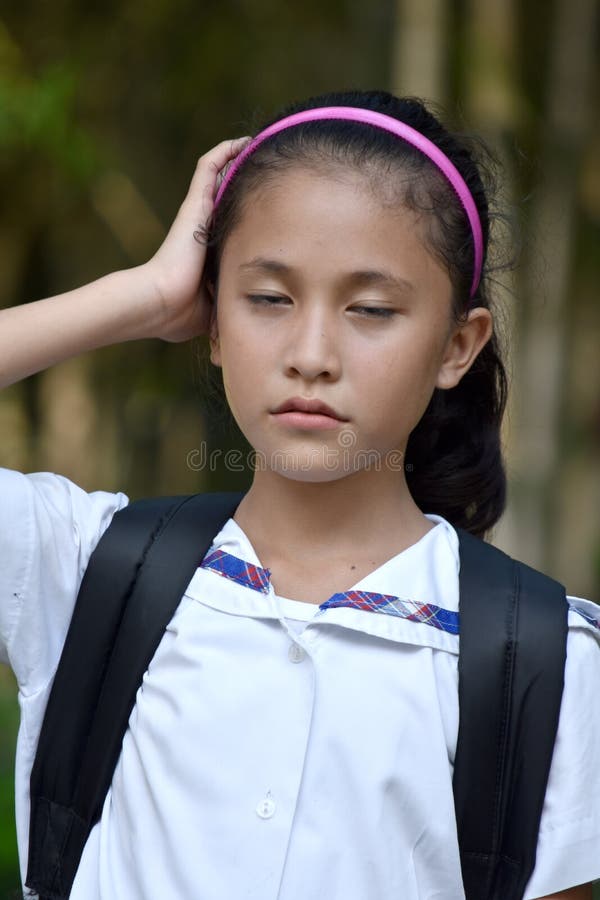 A Forgetful Female Student stock image. Image of pupil - 143973923