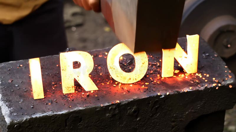 Forging Glowing Iron Letters on Anvil with Sparks Flying Stock Footage ...