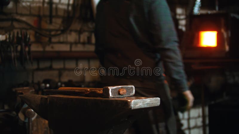 Forging Industry - a Man Blacksmith Putting His Instruments on the ...