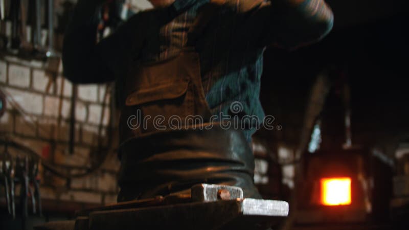 Forging Industry - a Man Blacksmith Putting His Instruments on the ...