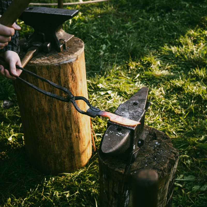 Forging a Knife in an Open-air Blacksmith S Workshop Stock Photo ...