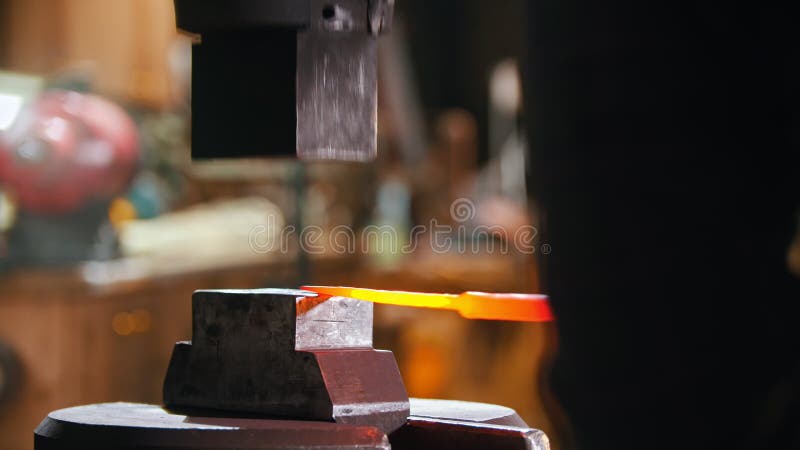 Forging an Object Out of Hot Metal Using an Industrial Pressure Machine ...