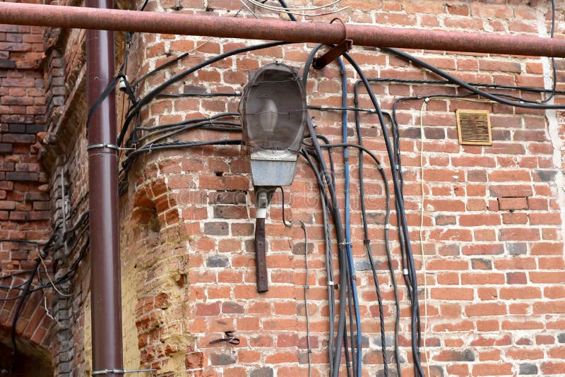 Old Idle Lantern and Electrical Wires on the Wall. Stock Photo - Image ...