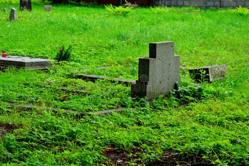 A Forgotten Ruined Cemetery Overgrown with Grass. Stock Photo - Image ...