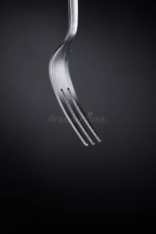 Fork in Black Background: Vertical Stock Image - Image of manufactured ...