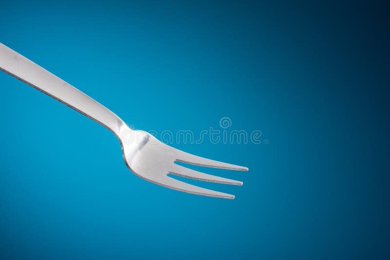 Fork in Blue Background in Studio Stock Image - Image of metal, blank ...