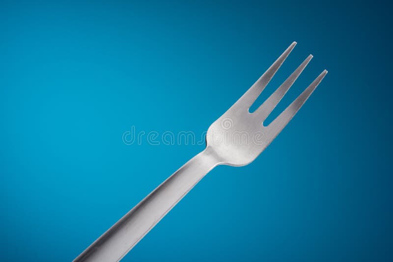 Fork in Blue Background in Studio Stock Photo - Image of colored ...