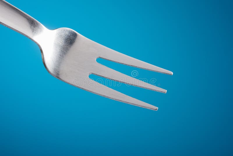 Fork in Blue Background in Studio Stock Photo - Image of colored ...