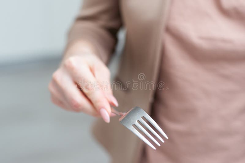 Fork in a Hand on a White Background Isolation Stock Photo - Image of ...