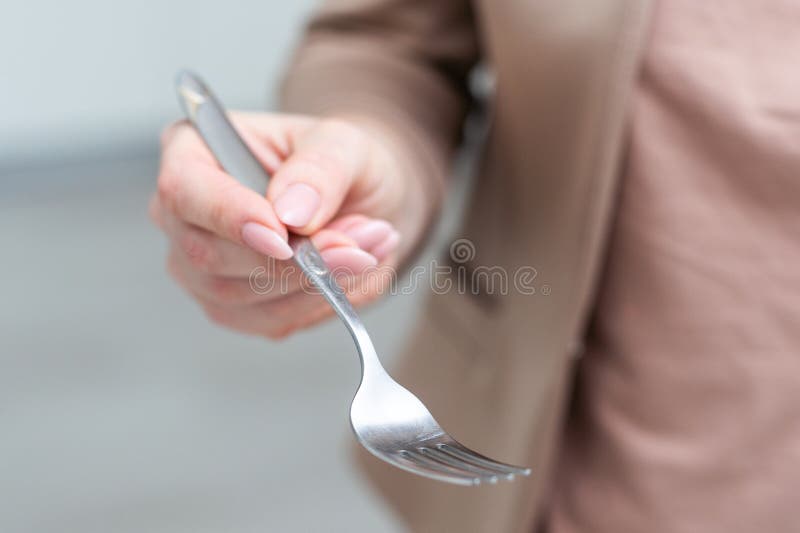 Fork in a Hand on a White Background Isolation Stock Image - Image of ...