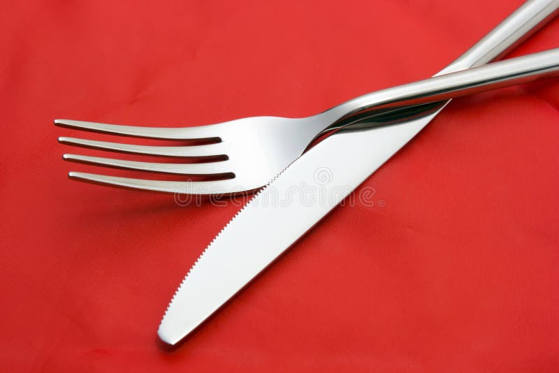 Fork and knife on red stock photo. Image of shiny, cloth - 29638792
