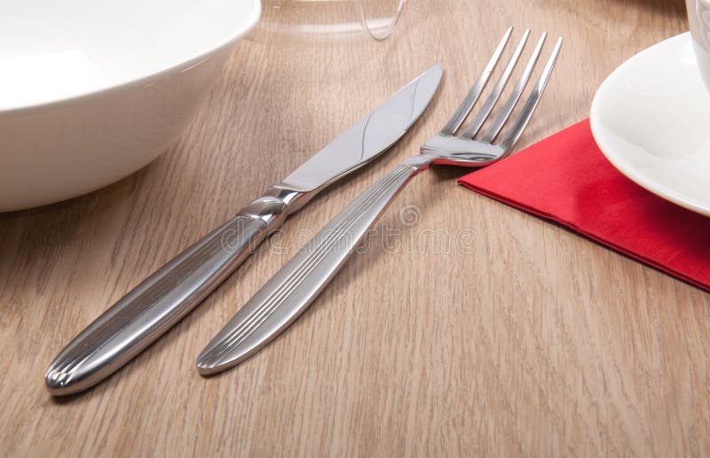Fork and knife on a table stock image. Image of dish - 23510723