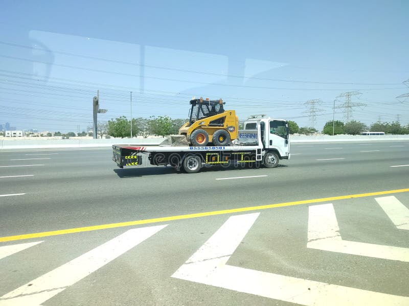 Fork Lift Machine on Top a Truck Moving on the Road Editorial Image ...