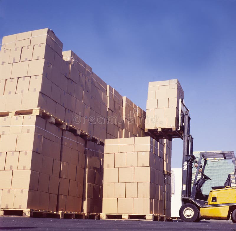 Fork Lift Truck ,cargo,Forklift Lifting a Pallet of Many Packages Stock ...