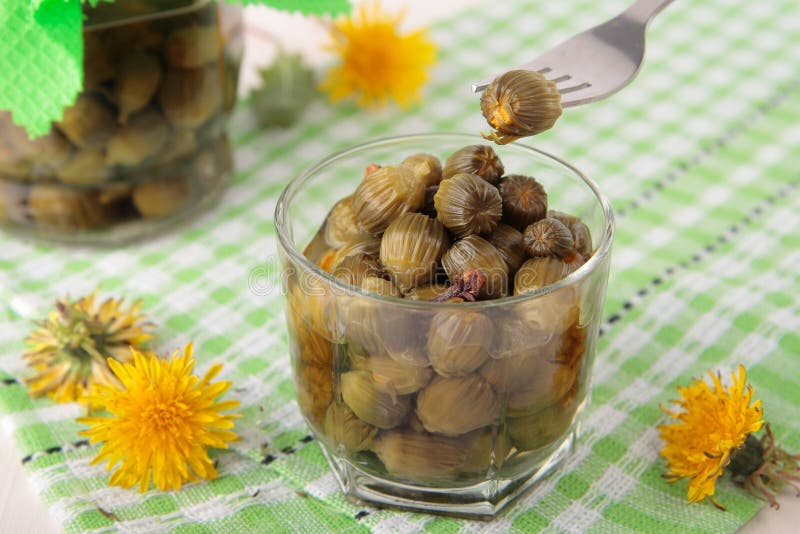 Fork with Pickled Flower Buds of Dandelions Stock Image - Image of ...