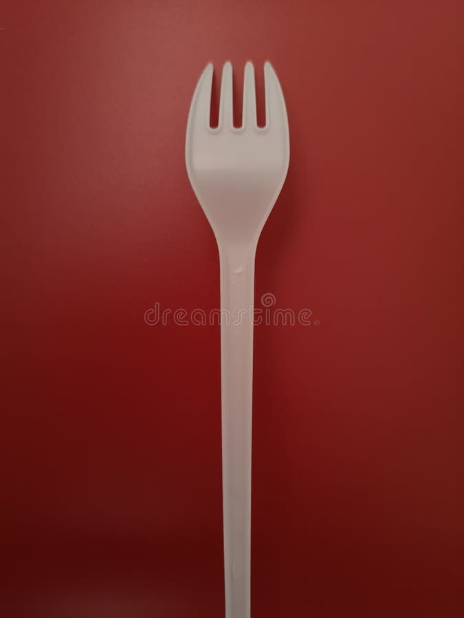 Fork on the red background stock image. Image of background - 123909593