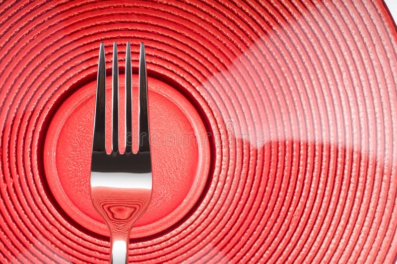 Fork on red plate stock image. Image of macro, fork, angle - 21708999