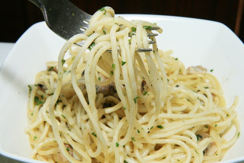 Fork on spaghetti stock image. Image of italian, garlic - 6916463