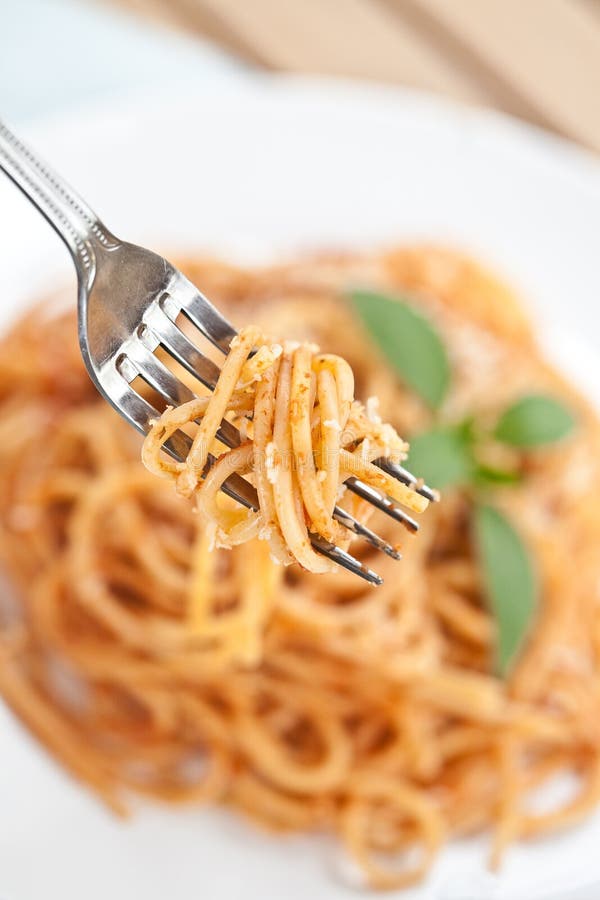 Fork with Spaghetti with Tomato Sauce and Basil Stock Photo - Image of ...