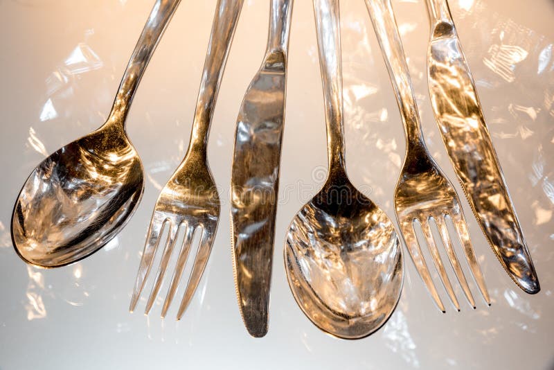 Fork, Spoon and Knife with Reflections Stock Photo - Image of shiny ...