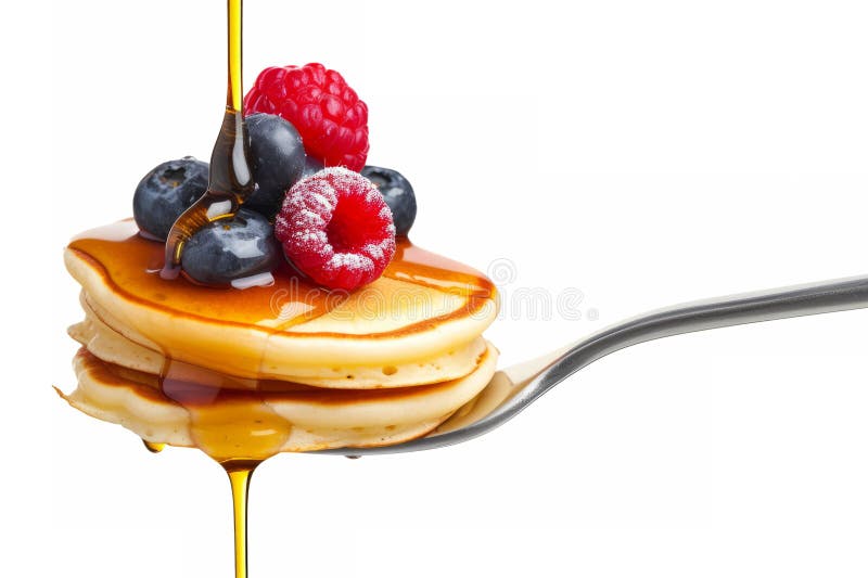 A Fork with a Stack of Mini Pancakes Drizzled with Syrup and Topped ...