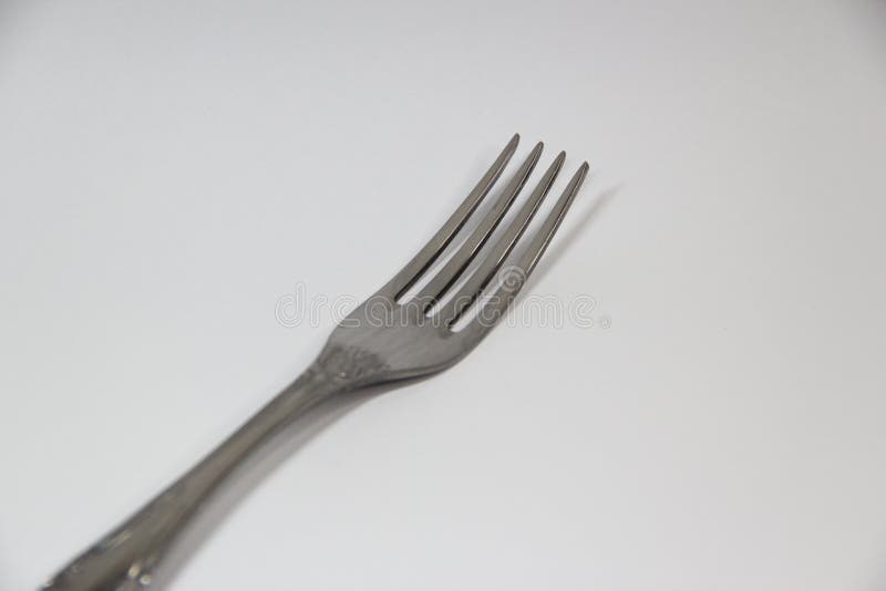 Fork on white background stock photo. Image of kitchen - 197137146