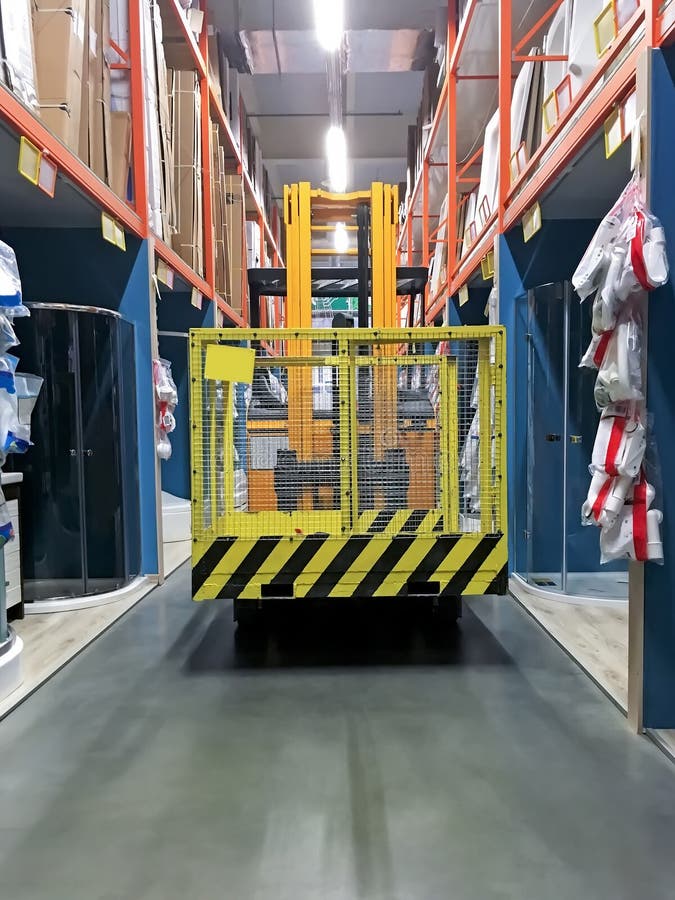 Forklift On A Building Site Next To Renovated House With Scaffolding ...