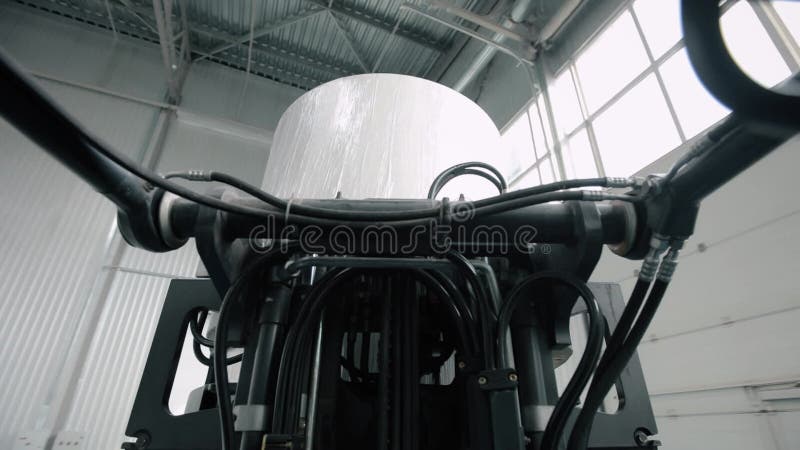 A Forklift is Carrying Paper at the Factory. the Forklift is Carrying a ...