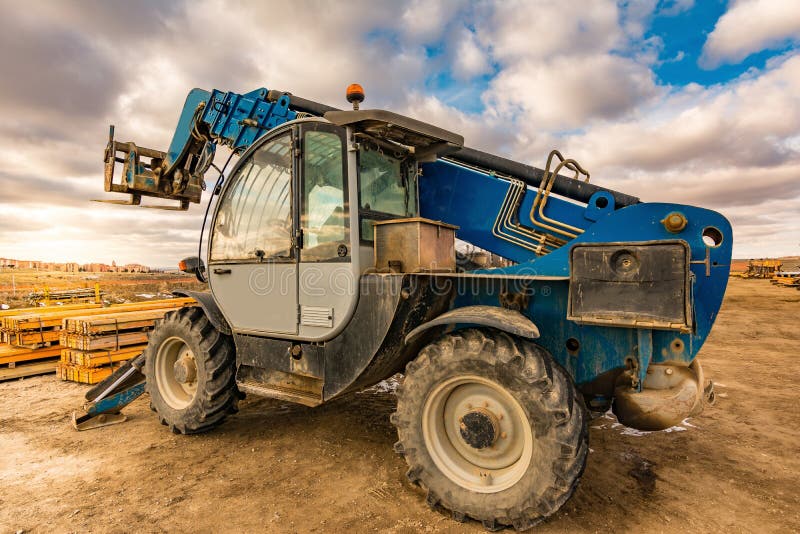 Forklift on a Construction Site, Preparing To Raise Construction Parts ...