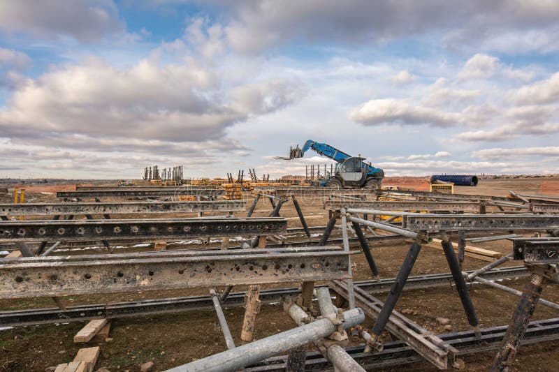 Forklift on a Construction Site, Preparing To Raise Construction Parts ...
