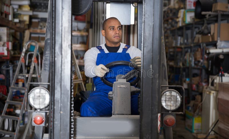 Forklift Driver Driving at Hardware Store Stock Image - Image of male ...