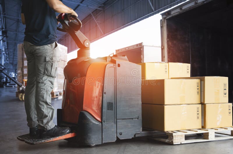 Forklift Driver Loading Package Boxes into Cargo Container at Dock ...