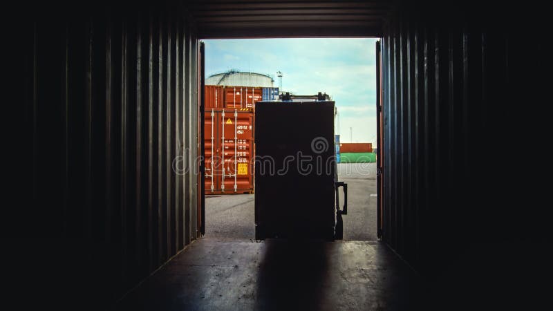 Forklift Driver Loading or Unloading a Shipping Cargo Container with a ...