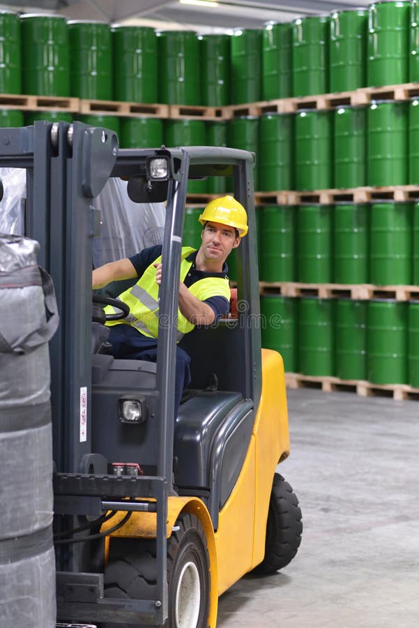Forklift Driver in a Logistics Hall of a Chemical Warehouse Stock Image ...