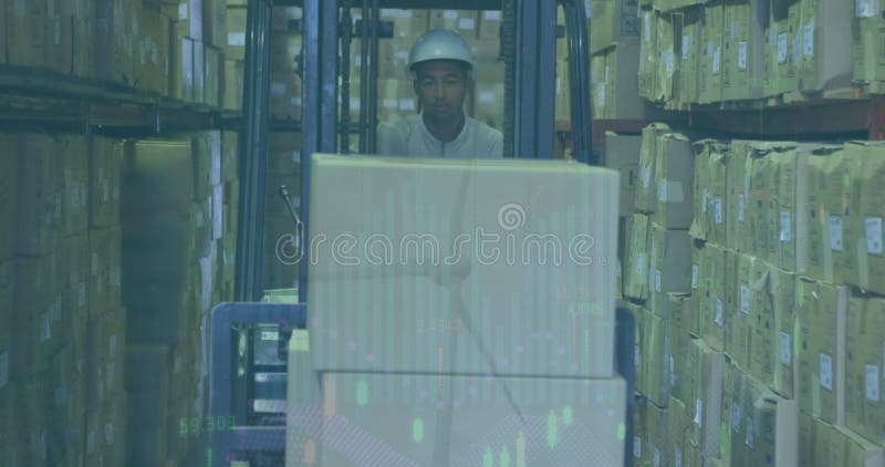 A Forklift Driver Picking Up a Palette of Boxes in a Large Warehouse ...
