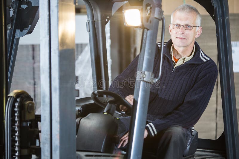Forklift driver posing stock photo. Image of shelf, distribution - 41924516