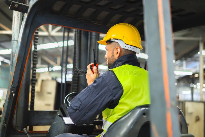 Forklift Driver Talking on Radio for Professional Cargo Shipping ...