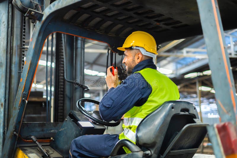 Forklift Driver Talking on Radio for Professional Cargo Shipping ...