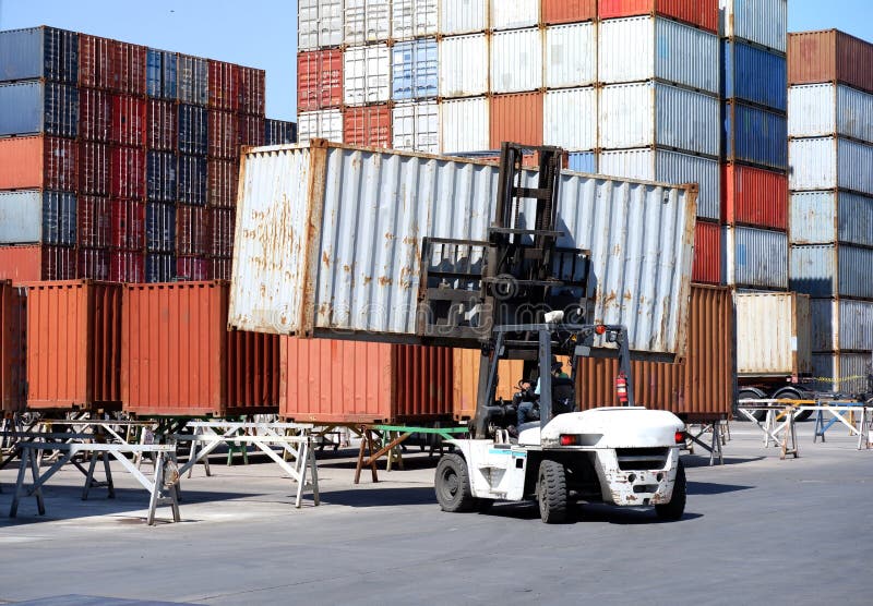 Forklift Driver Using Walkie-talkie in Industrial Container Warehouse ...
