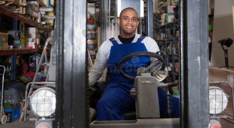 Forklift Driver at the Warehouse of Hardware Store Stock Photo - Image ...