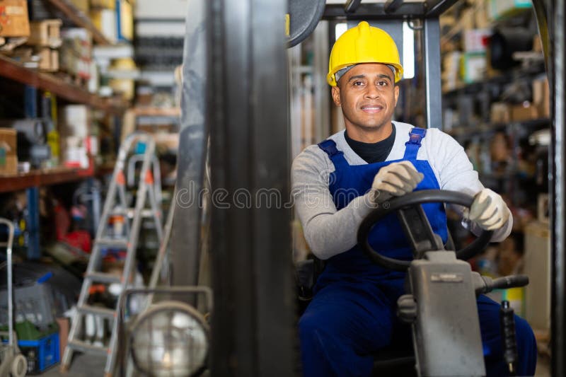 Forklift Driver at the Warehouse of Hardware Store Stock Photo - Image ...