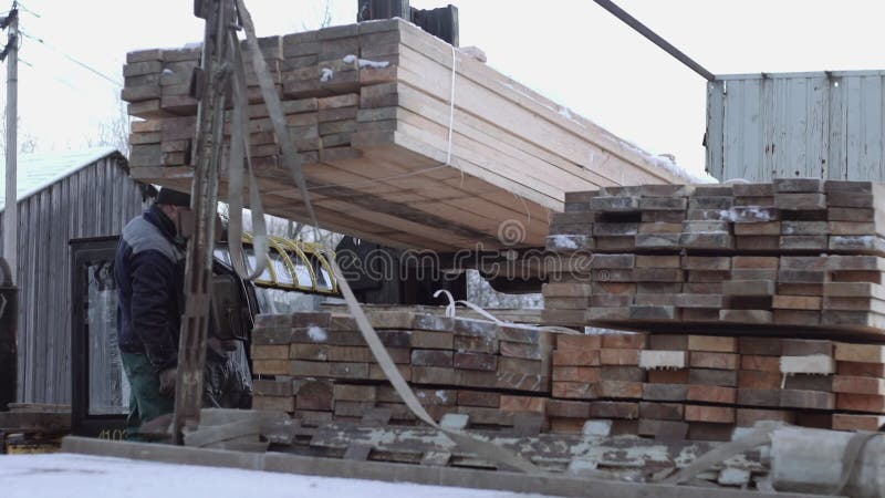 Forklift Driver and Workers Straightening Plank Stack on Lorry Loader ...