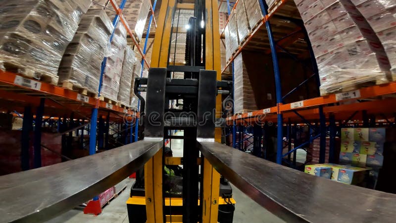 Forklift Fork Close-up. the Load Lifter Rides on the Warehouse Pov ...