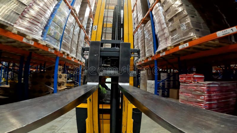 Forklift Fork Close-up. the Load Lifter Rides on the Warehouse Pov ...